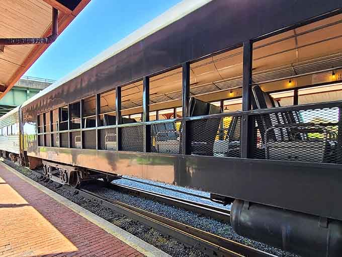The open-air observation car where wind-in-your-hair meets unobstructed mountain views, no windshield required.