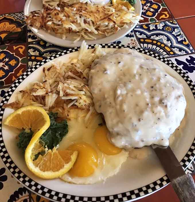 That chicken fried steak with country gravy is the kind of plate that makes you understand why comfort food exists.