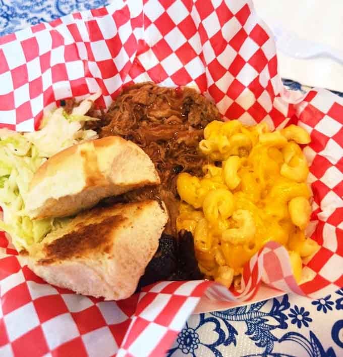 BBQ pork, mac and cheese, and coleslaw form the holy trinity of Southern comfort on one plate.