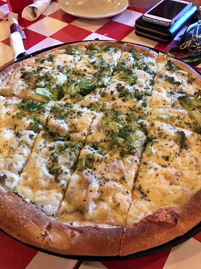 White pizza topped with broccoli proves that vegetables can absolutely steal the show on a perfectly crafted pie.