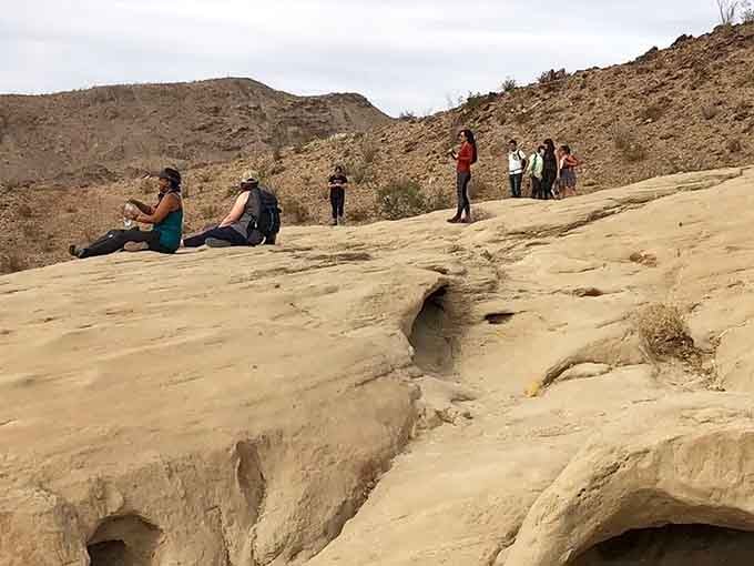 Nothing says "we made it" quite like sitting on ancient rock formations and contemplating your snack choices.