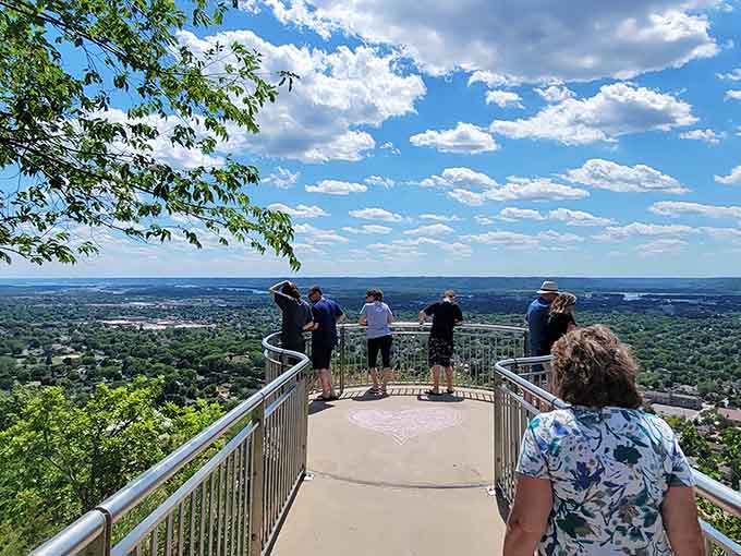 The overlook platform draws visitors who've earned this view with a hike that reminds your legs they still work after all.