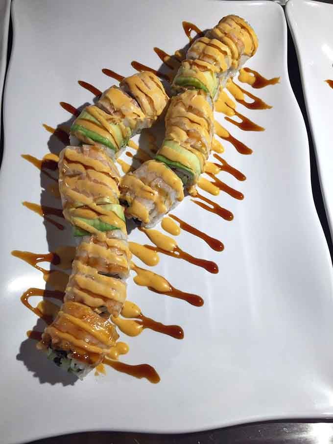 Sushi with fancy sauce drizzles at a buffet? Someone pinch you because this might be a dream.