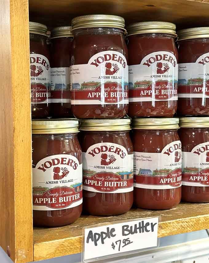 Rows of homemade apple butter waiting to transform your morning toast into something worth waking up for, one jar at a time.