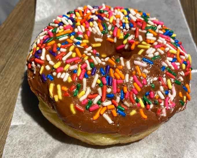 Rainbow sprinkles piled this high aren't just decoration, they're a commitment to joy in its most colorful form.