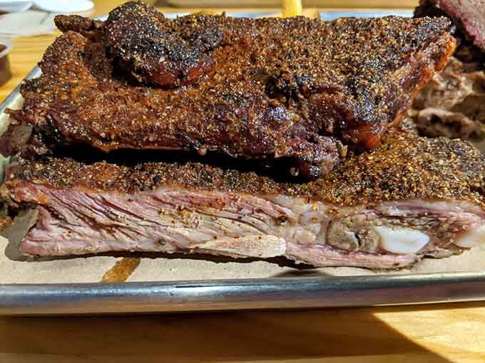 Those ribs have the perfect bark, beautiful smoke ring, and tender meat that'll haunt your dreams in the best way.