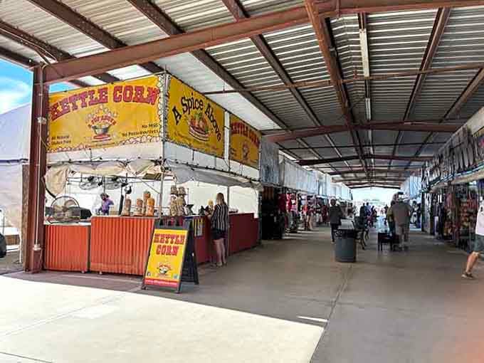 That "Kettle Corn" sign promises delicious snacking fuel for your treasure-hunting marathon through endless vendor stalls.