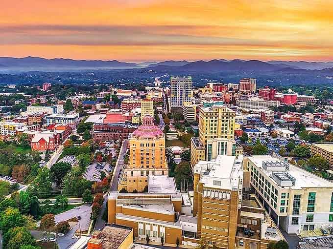 Mountains paint the horizon in layers of purple and blue while sunset ignites the sky in shades of tangerine and gold.
