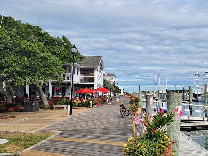 Marina views stretch endlessly from this boardwalk where every weathered post tells stories of fishing boats and summer days.