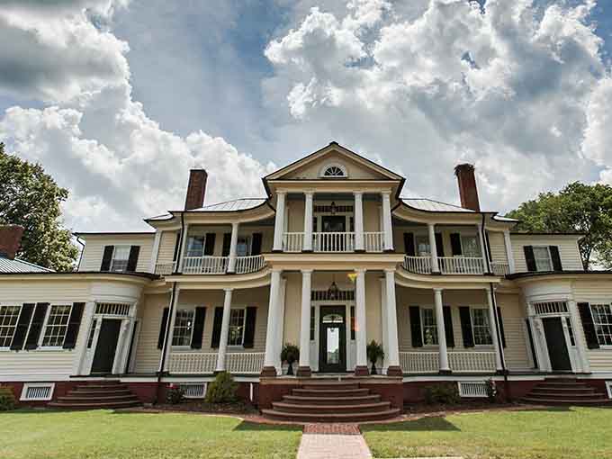 Those grand columns and sweeping porches scream "Gone with the Wind" vibes, minus Scarlett's drama.