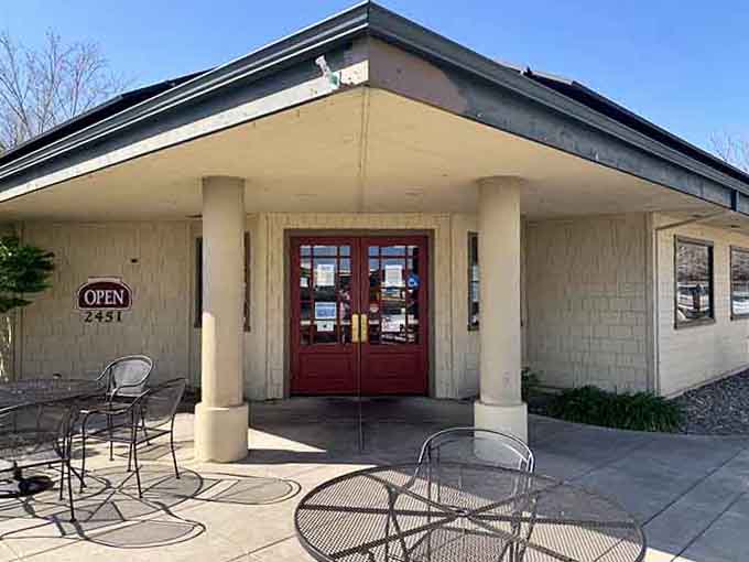 Classic columns frame the entrance to this charming burger spot that looks straight out of the 1950s.
