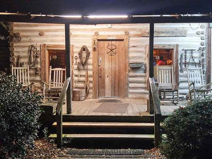 This rustic cabin porch at night practically beams with warmth, inviting you in for serious comfort food.