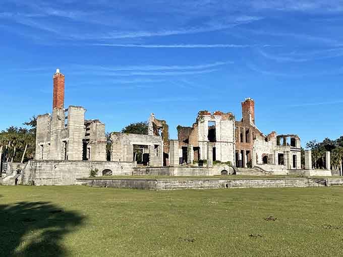 These haunting tabby ruins whisper stories of grandeur lost, their skeletal walls framed by palmettos and coastal sky.