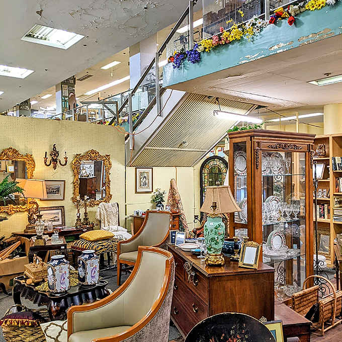 This elegant indoor space showcases antique furniture and vintage mirrors that could tell stories from generations past.