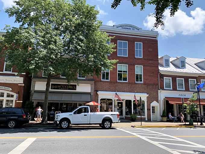 Historic buildings stand proudly along Main Street where American flags wave and local businesses still know your coffee order.