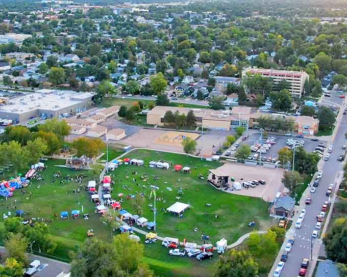 Community gatherings fill the green space where families spread blankets and share summer evenings together.