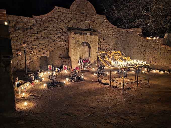 Hundreds of flickering candles transform this humble adobe wall into a glowing testament to hope and human connection.