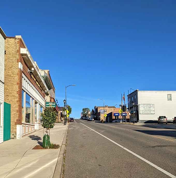 Clear blue skies stretch over downtown streets that feel refreshingly unhurried and genuinely welcoming to visitors.