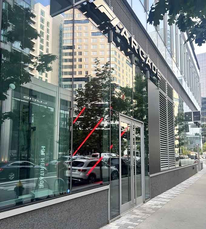 Sleek glass and modern architecture house racing simulators where speed meets sophisticated dining in perfect harmony.