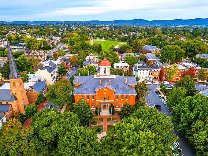 Frederick's downtown spreads beneath those distant mountains, with that gorgeous brick courthouse anchoring everything like a proud centerpiece.