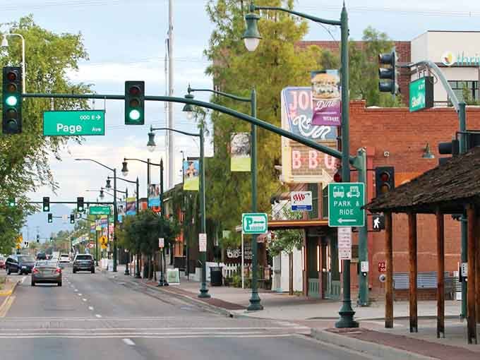 Tree-lined streets lead past colorful storefronts where small-town charm feels like stepping into a Hallmark movie.
