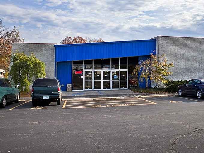 The bright blue accent stripe catches your eye from the road, beckoning thrift enthusiasts to discover what's new today.