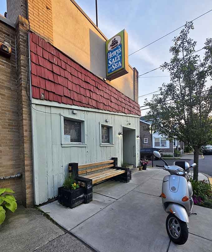 That vintage scooter parked outside adds European flair to this charming neighborhood seafood hideaway spot.