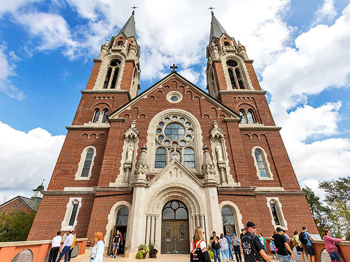 Twin spires reach heavenward from this stunning basilica, standing proud against billowing clouds like a European masterpiece.
