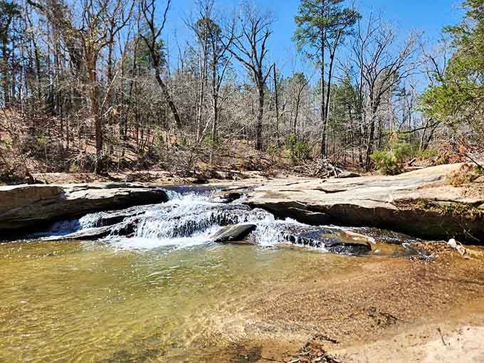 Nature's own lazy river flows gently over smooth rock, creating the perfect spot for dangling tired feet.