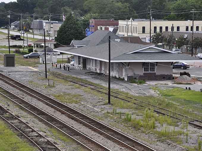 Railroad tracks stretch endlessly, reminding us of when trains connected small towns to the wider world.