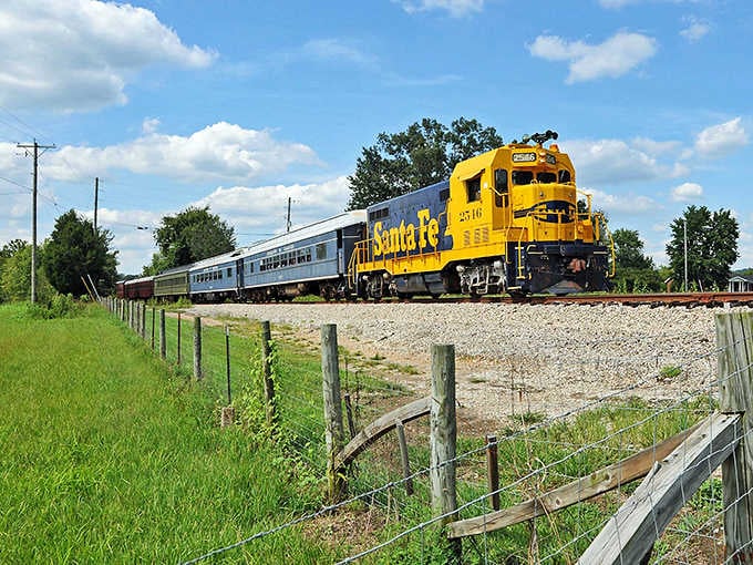 That brilliant yellow Santa Fe locomotive cutting through summer fields looks like a sunbeam racing across the countryside.