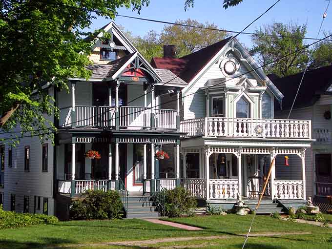 Double-decker porches dripping with gingerbread trim make this Victorian home look like a wedding cake come to life.