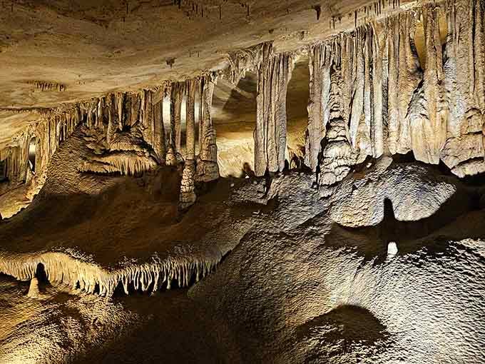 Nature's cathedral showcases stalactites hanging like frozen chandeliers, carved patiently over thousands of patient years.