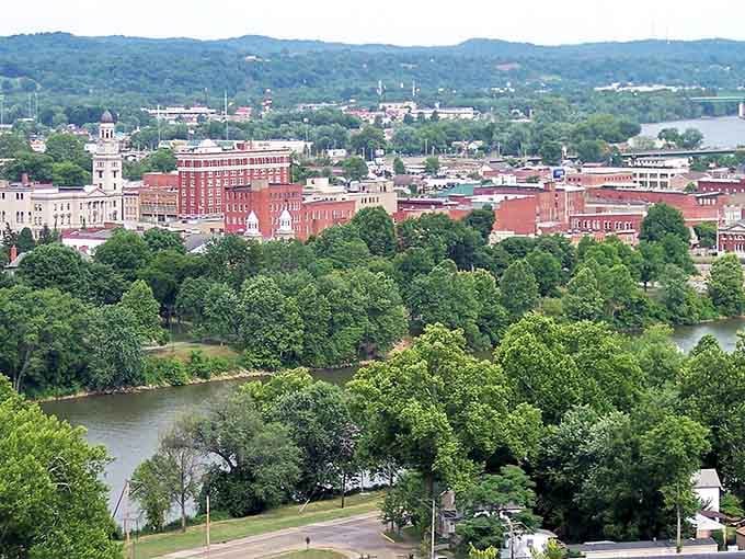 Rivers and red brick buildings create a timeless tableau where history and natural beauty embrace like old friends.