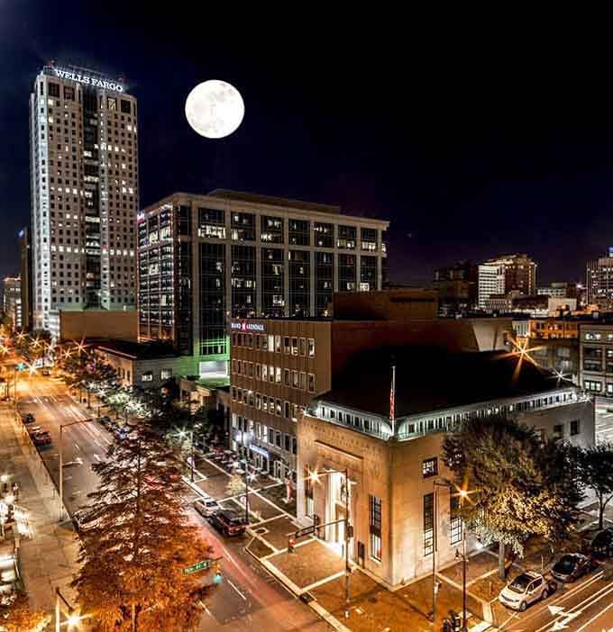 Under a full moon, the city lights twinkle like someone scattered diamonds across the downtown streets.