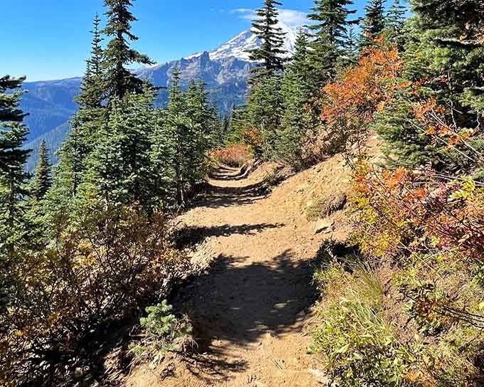This golden-hued trail winds through autumn colors with mountain views that'll make your heart skip a beat.