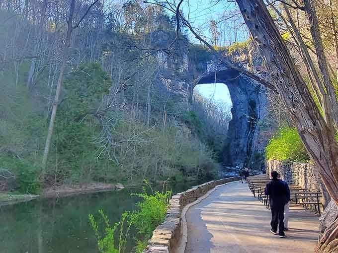 Walkers contemplate this massive stone arch that has stood as nature's triumph over time for countless generations.