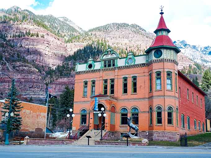 That red brick courthouse with its distinctive clock tower anchors a town that's pure mountain magic.