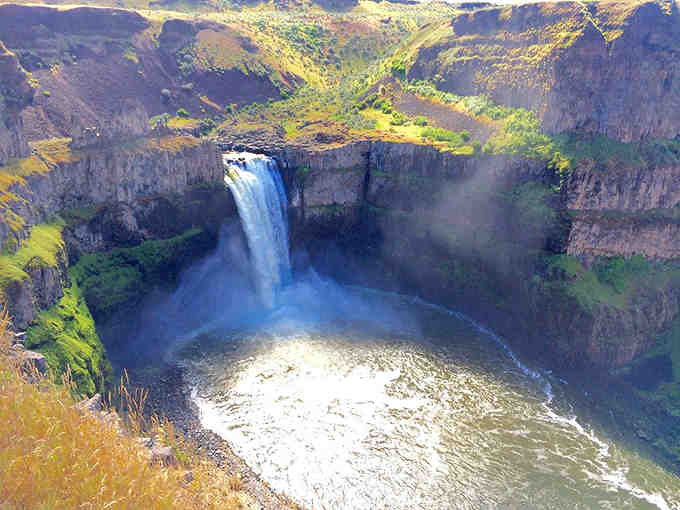 This aerial view reveals nature's perfect amphitheater where water performs its most spectacular show daily.