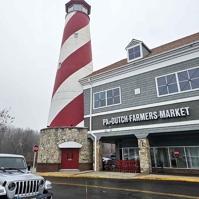 A candy-striped lighthouse towers over the market like something from a whimsical seaside dream on cloudy days.