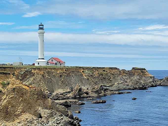 Rising like a gleaming white column against endless sky, this tall beacon commands attention from miles around the coast.