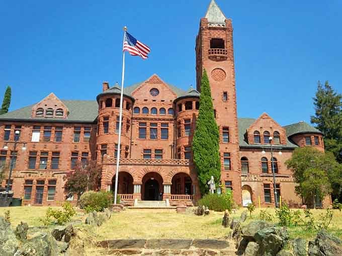 Preston Castle's Romanesque towers rise like something from a Gothic novel, all red brick and turrets against California's blue sky.