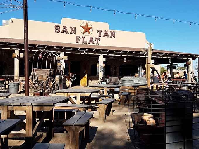 Rustic wagons, weathered wood, and endless blue skies create the perfect backdrop for barbecue and cold drinks under the sun.