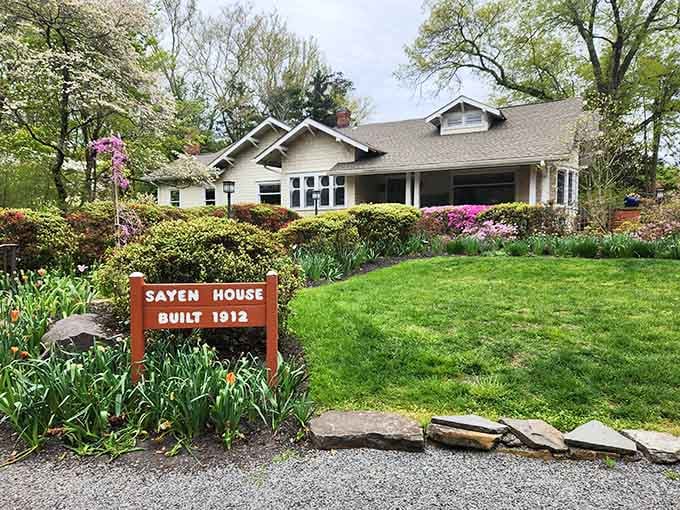 The historic Sayen House welcomes visitors with spring blooms that frame this charming 1912 craftsman beauty perfectly.