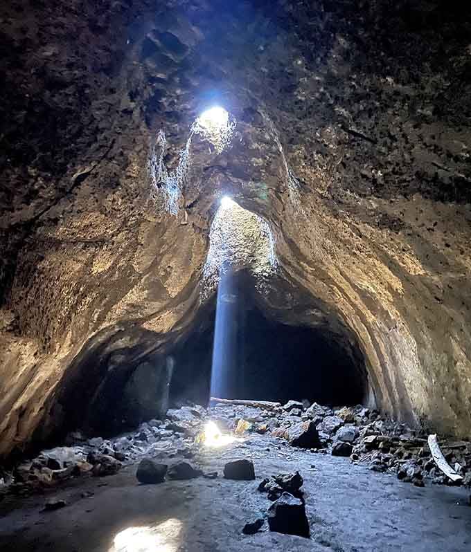 Sunlight pours through the cave's natural skylight, creating a beam that would make any cinematographer jealous.