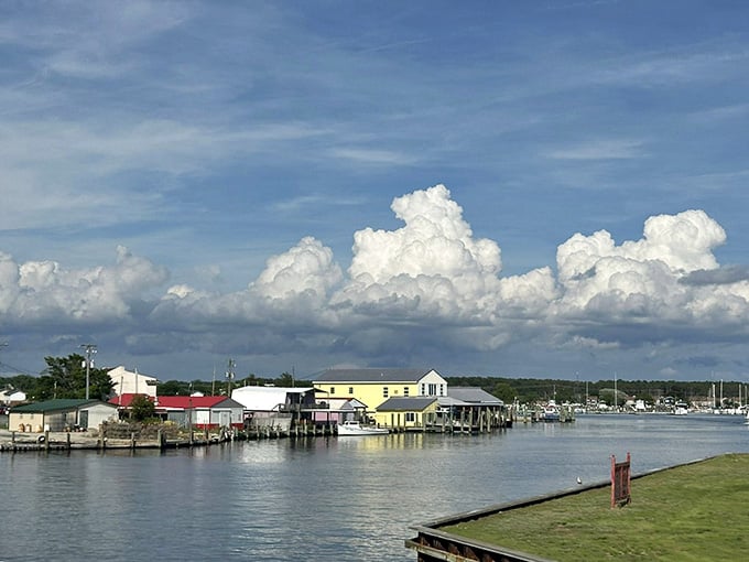 Those clouds look like something from a postcard, towering over this peaceful waterfront community that time almost forgot.