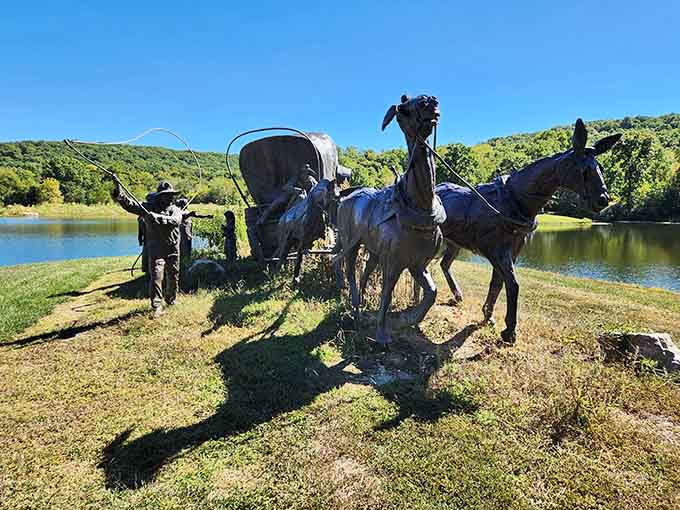 A pioneer wagon and oxen stand frozen in time, capturing the spirit of westward journeys against rolling hills.