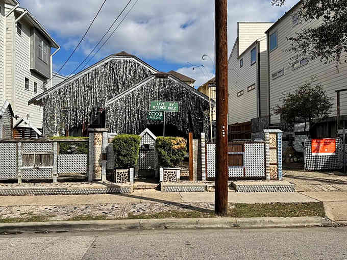 Thousands of flattened aluminum cans shimmer like fish scales, transforming an ordinary home into extraordinary folk art.