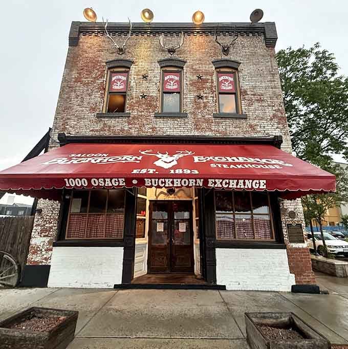 Weathered brick and that classic red awning mark Colorado's oldest restaurant, where history hangs on every wall and antler.