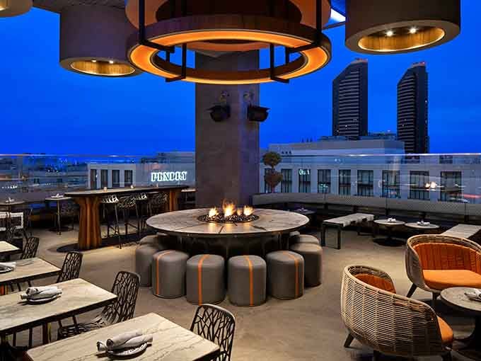 Blue hour brings out the fire pits and golden lighting for cozy conversations under the stars.